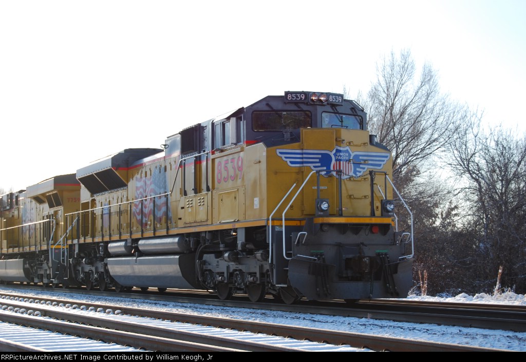 UP 8539 close up shot why waiting for a west bounder to pass by